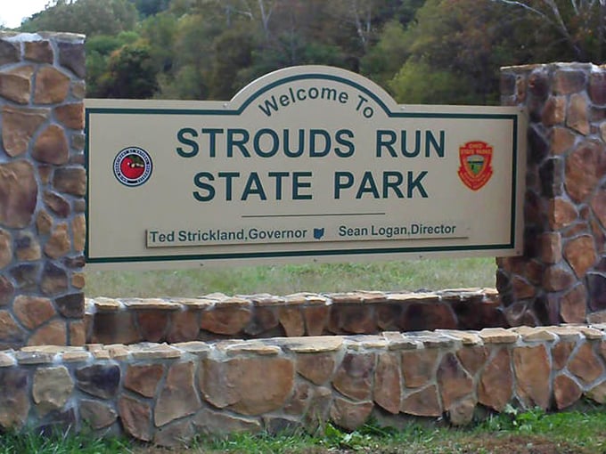 The stone-flanked welcome sign stands like a friendly gatekeeper, promising adventures that your fitness tracker will definitely want to document.