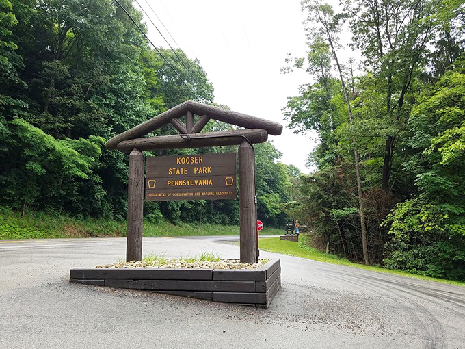 The gateway to tranquility. This rustic wooden sign doesn't just mark an entrance&mdash;it's your official invitation to leave stress behind.