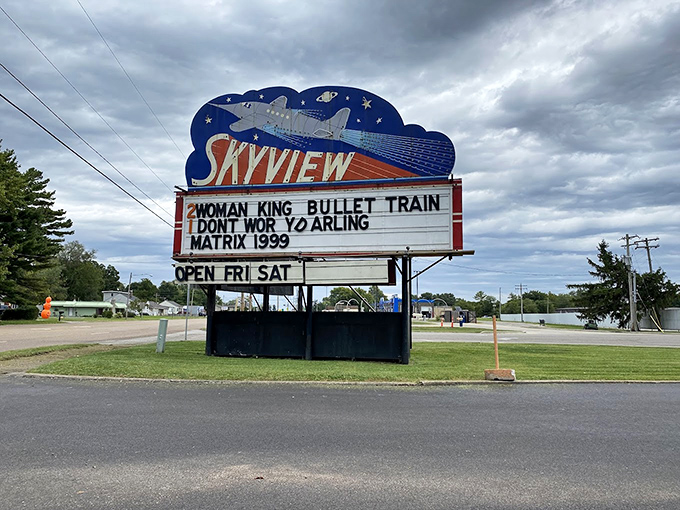 The iconic Skyview marquee stands as a retro beacon, promising cinematic adventures with its space-age design and bold movie titles.