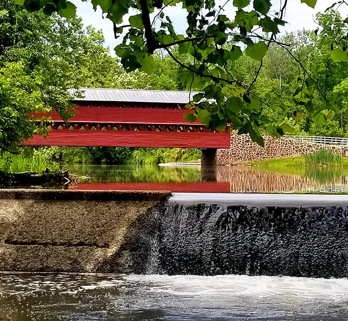 Nature provides its own soundtrack here, with water cascading beneath the bridge in a gentle rhythm that predates the Civil War.