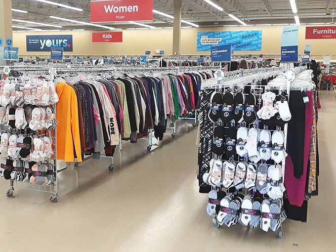 Color-coded clothing racks stretch toward the horizon, promising fashion treasures for those willing to embark on the hunt.