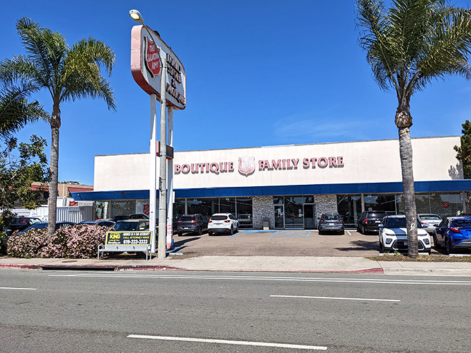 Palm trees stand guard outside this thrifting mecca. The California sun highlights the promise of discoveries waiting just beyond those glass doors.