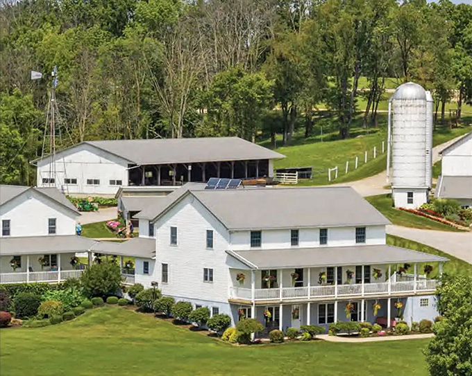 Postcard-perfect Amish country. White farmhouses with wrap-around porches, meticulously maintained barns, and a silo standing sentinel over the peaceful landscape.