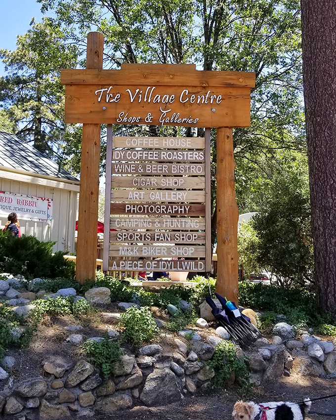 The Village Centre sign promises treasures within &ndash; like a wooden menu board for the soul offering everything from coffee to cigars.