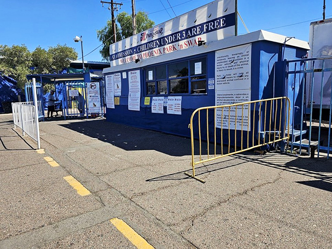 The blue ticket booth where your weekend adventure officially begins with friendly faces.
