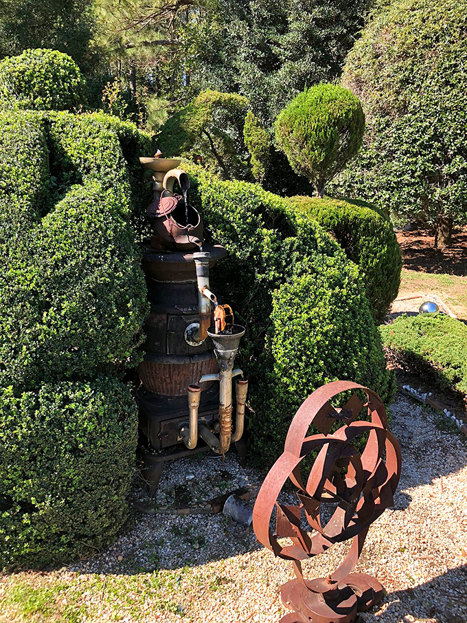 Where shrubs meet sculpture! This creative fusion showcases both botanical artistry and repurposed metal, proving beauty can grow alongside industrial elements.