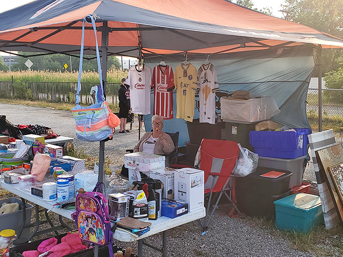 Sports jerseys and childhood nostalgia share space under this vendor's canopy&mdash;proof that one person's decluttering is another's discovery.