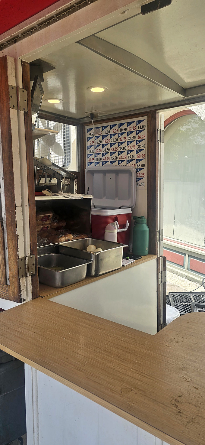 Inside this tiny culinary capsule, simplicity reigns supreme. No fancy equipment needed when you've perfected your craft over a century. 