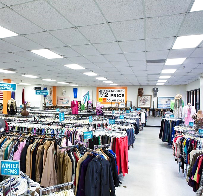 Organized chaos at its finest! Row after row of potential wardrobe upgrades await, with color-coded tags that savvy shoppers hunt like detectives on a case.