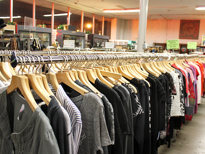 Meticulously organized clothing racks break the thrift store stereotype. No archaeological digs required here&mdash;just row after row of carefully curated fashion finds.