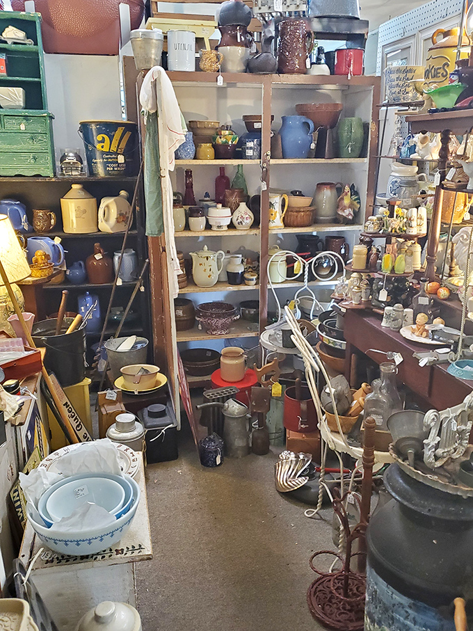 Pottery paradise! Shelves groan under the weight of decades past, each ceramic piece whispering stories of Sunday dinners and holiday gatherings.