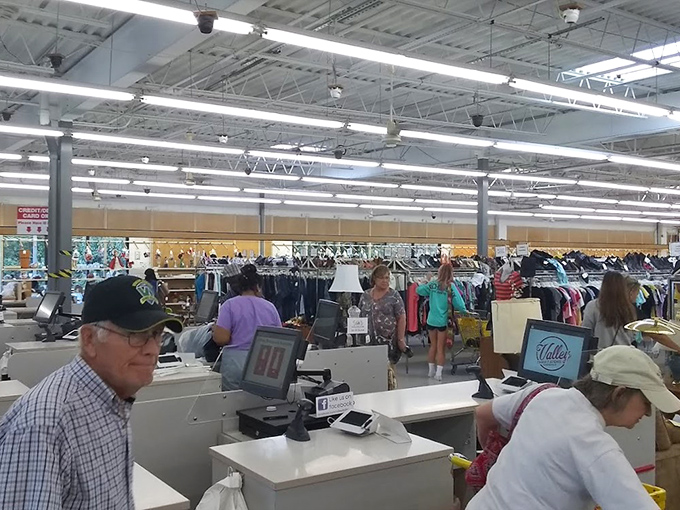 The checkout area buzzes with activity as shoppers complete their treasure hunts. Those smiles say it all: mission accomplished!