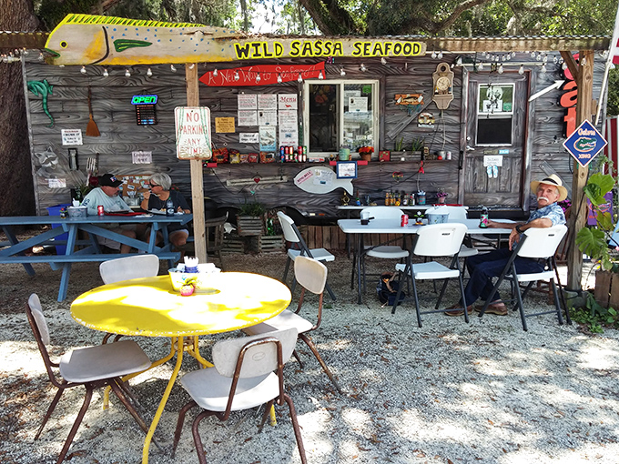 The humble outdoor seating area&mdash;complete with that unmissable sunshine-yellow table&mdash;might lack white tablecloths, but offers something pricier joints can't: genuine coastal atmosphere.