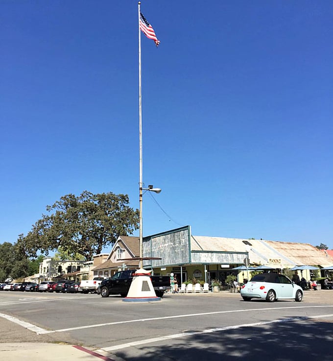 The iconic flagpole stands sentinel at the heart of town, where locals still say "meet me at the flagpole."