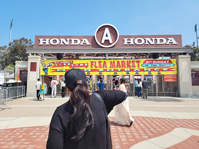 The iconic entrance to bargain heaven. The Honda sign stands sentinel as shoppers eagerly enter this monthly ritual of discovery and delight.