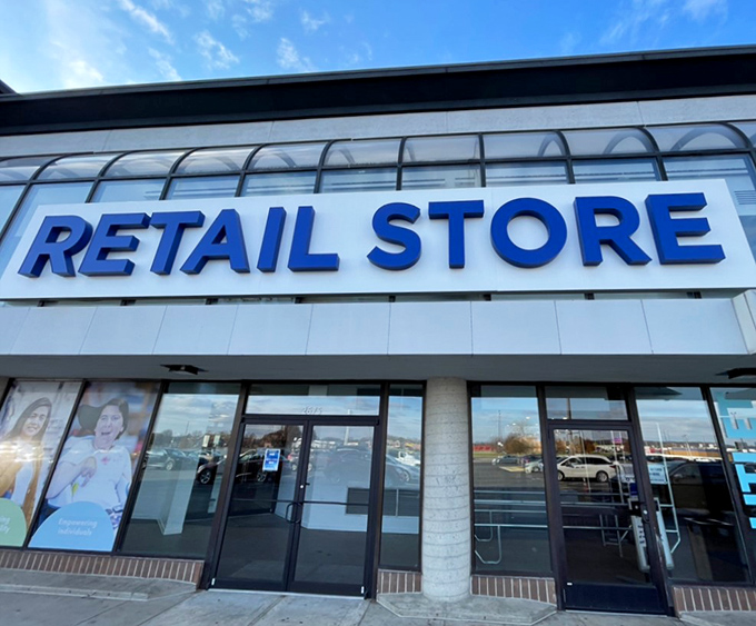 Bold blue lettering beckons bargain hunters through these doors. The thrill of the hunt begins where that shopping cart path leads.