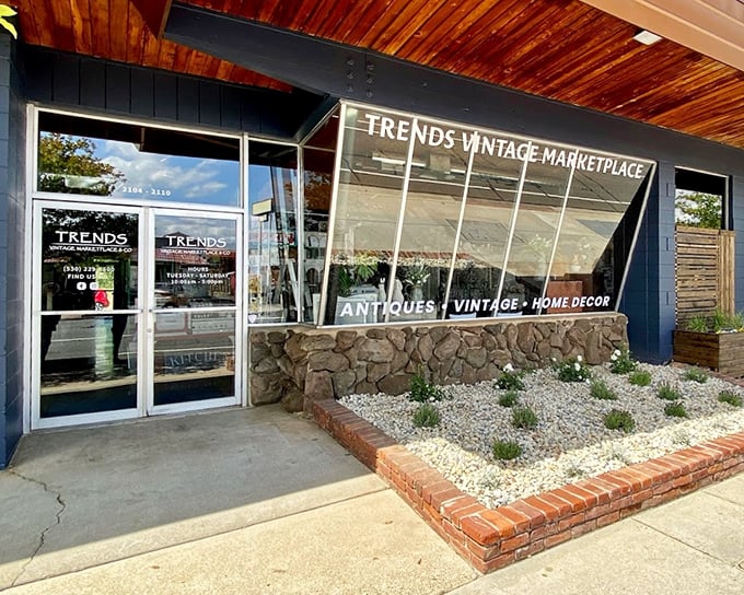 Modern meets vintage at this entrance, where the stone foundation and wooden ceiling hint at the timeless treasures awaiting within.