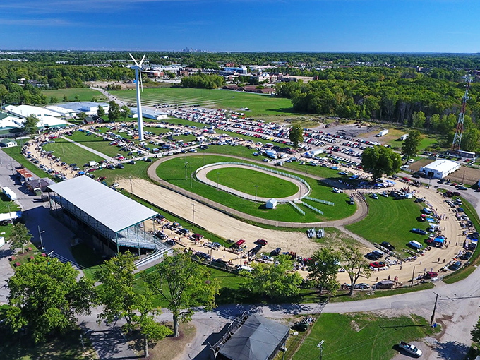 The fairgrounds transform into a bargain hunter's paradise, with the iconic wind turbine standing sentinel over a sea of tents and tables.