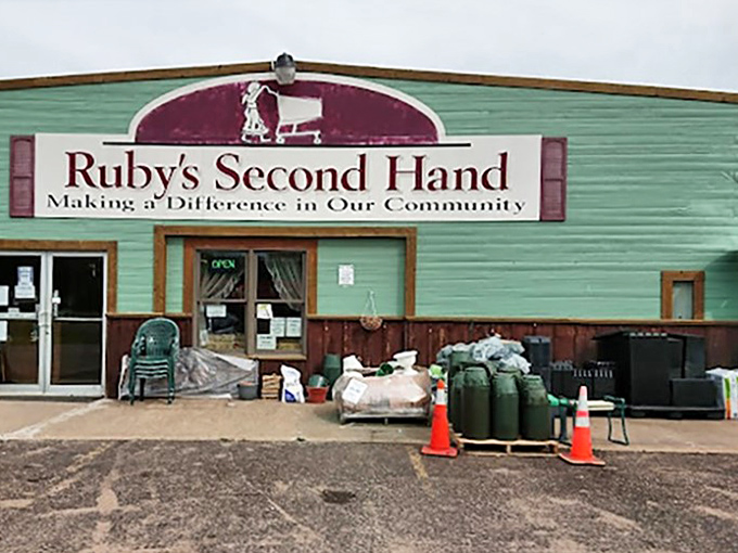 The mint-green exterior with burgundy trim stands like a beacon to bargain hunters, promising adventures in secondhand splendor inside.