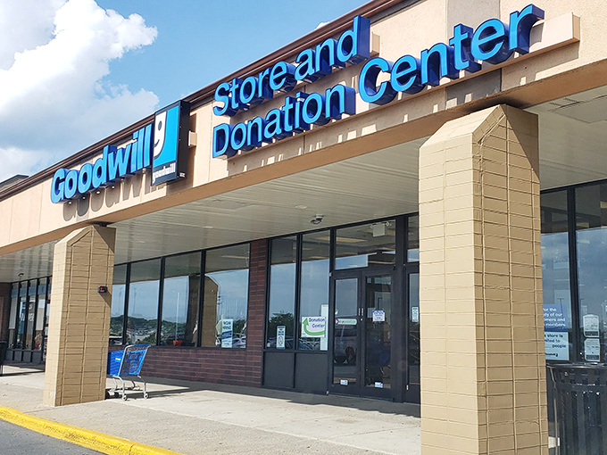Morning light catches the iconic blue signage, promising adventures in secondhand splendor for those brave enough to enter.