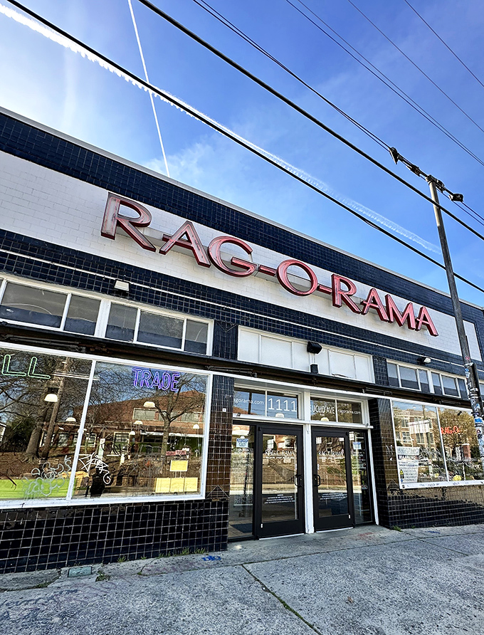 Sunlight plays across Rag-O-Rama's vintage storefront, where the neon "TRADE" sign promises fashion adventures without the first-hand price tag.
