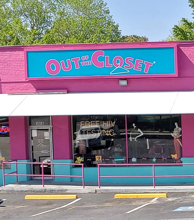 That vibrant turquoise sign against hot pink brick isn't just eye-catching; it's announcing a treasure hunt where your wallet and conscience both win.