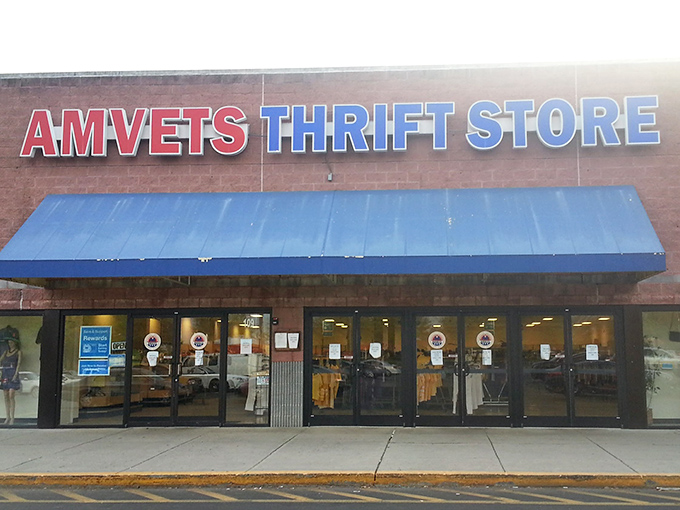 The iconic red and blue signage beckons bargain hunters and treasure seekers alike. That blue awning has sheltered generations of thrift enthusiasts from both rain and retail regret.