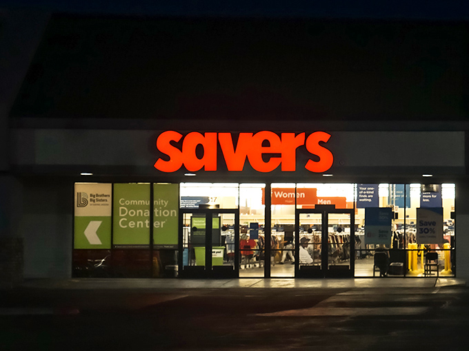 Even after hours, the Savers storefront beckons with its warm glow&mdash;like a museum of everyday artifacts that opens its doors to everyone.
