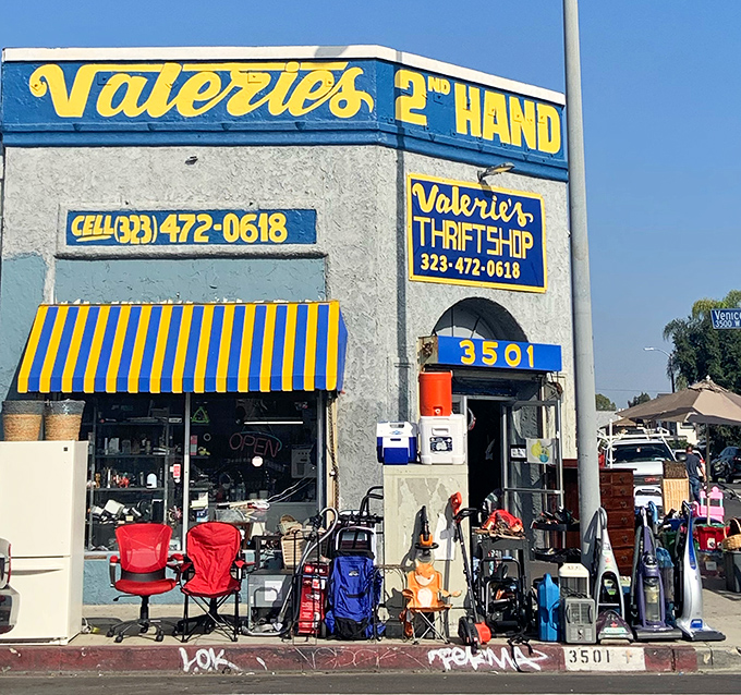 The iconic yellow-striped awning and sidewalk displays create that irresistible "stop the car!" moment for thrift hunters cruising through Los Angeles.
