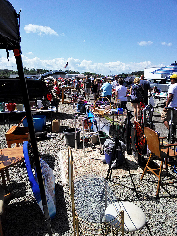 Crowds navigate the gravel pathways like explorers in a retail jungle, each shopper on their own quest for that perfect something they didn't know they needed.