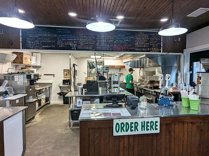 Where burger magic happens. The chalkboard menu and open kitchen layout tell you this place values transparency almost as much as taste.