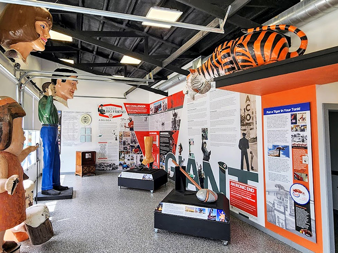 Step inside and you're immediately dwarfed by fiberglass titans. That suspended tiger once convinced America to "Put a Tiger in Your Tank" at Esso stations nationwide.