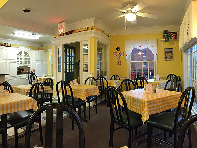 Sunshine yellow walls and checkered tablecloths create the kind of cozy atmosphere that makes you want to linger over that third cup of coffee.