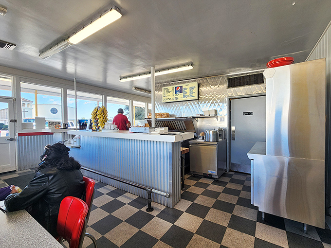 Inside, the classic checkered floor and corrugated metal counter transport you to a simpler time when calories weren't counted and joy was measured in bites.