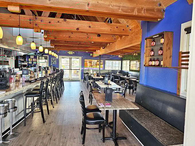 Exposed wooden beams and vibrant blue walls create the perfect nautical backdrop for seafood indulgence. Like dining in a stylish ship's cabin, minus the seasickness.