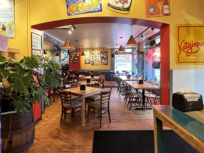 Warm yellow walls, nostalgic signage, and the buzz of satisfied customers create the perfect backdrop for sandwich worship in this cozy dining room.
