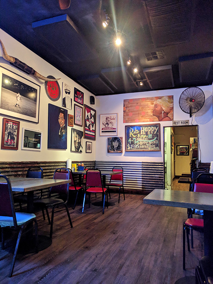 Wall-to-wall personality with music posters and corrugated metal wainscoting&mdash;this isn't corporate decor, it's barbecue with character and soul.