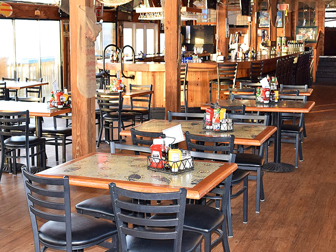 Inside, exposed wooden beams frame a dining space that feels like the world's most delicious ship's cabin. Nautical without the kitsch.