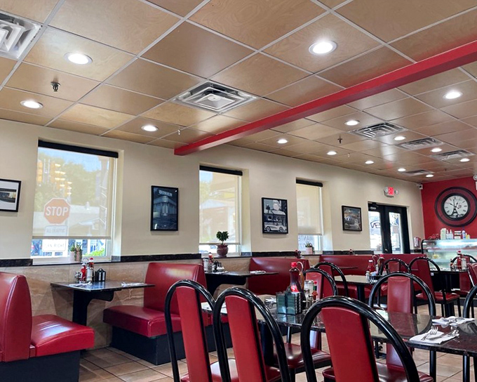 Classic red vinyl booths and warm lighting create that timeless diner atmosphere where calories don't count and coffee refills are infinite.