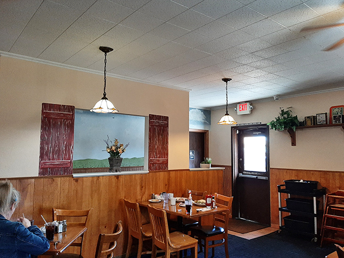 Cozy wood paneling and simple d&eacute;cor create that rare atmosphere where conversations flow as freely as the coffee. The painted "windows" are California's answer to Midwestern charm.