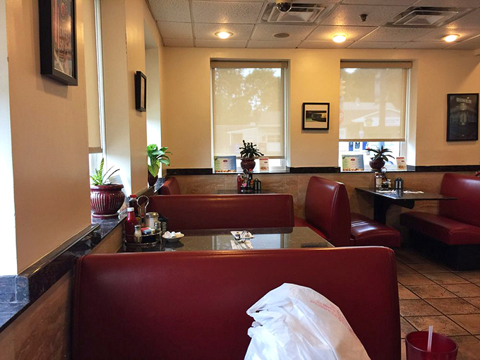 Classic red vinyl booths invite you to slide in and stay awhile. This isn't Instagram-bait d&eacute;cor&mdash;it's the real deal, battle-tested by decades of happy diners.