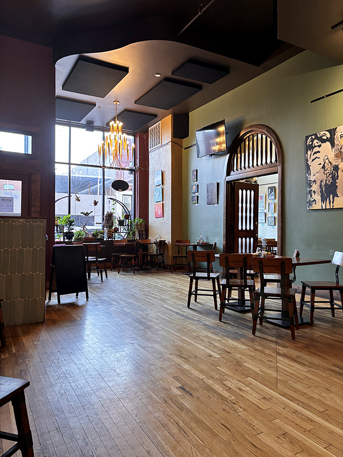 Step into breakfast paradise where wooden floors meet high ceilings and ambient lighting creates the perfect setting for morning contemplation and coffee consumption.