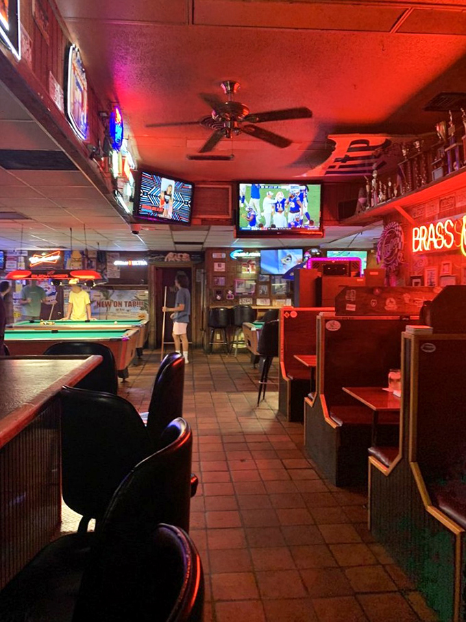 The warm red glow of this classic pub interior says it all: put down your phone, grab a cold one, and prepare for burger bliss.