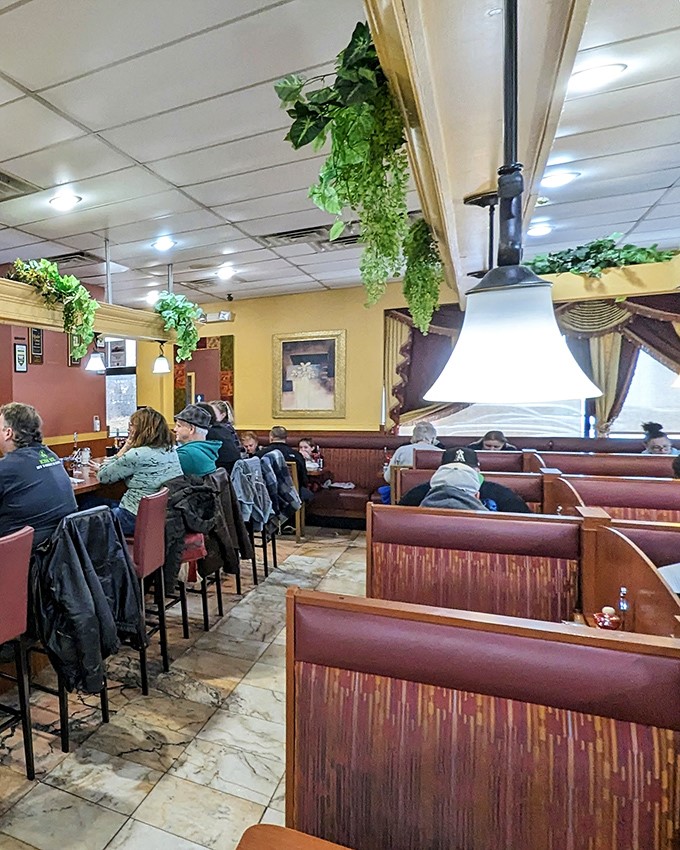 Inside, wooden booths and hanging plants create that perfect diner atmosphere&mdash;part time capsule, part community living room, all comfort.