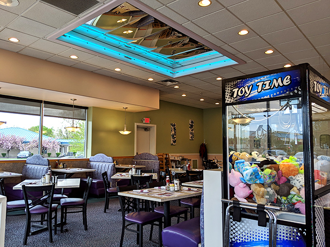 That blue skylight isn't just for show&mdash;it bathes the dining room in gentle light while the toy machine stands guard, promising prizes for well-behaved diners of all ages.
