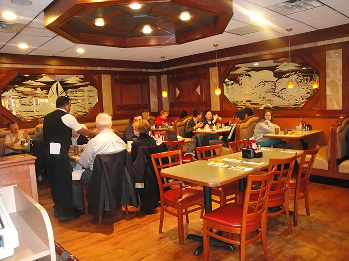 Wood paneling, etched glass nautical scenes, and comfortable booths create the perfect habitat for that endangered species: the authentic American diner experience.