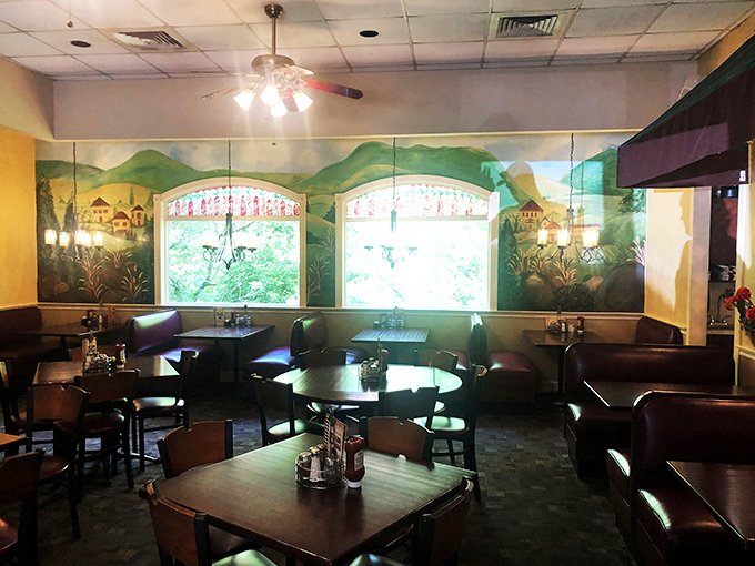 Step inside to find a dining room where pastoral murals and warm lighting create the perfect backdrop for the sandwich symphony about to unfold.