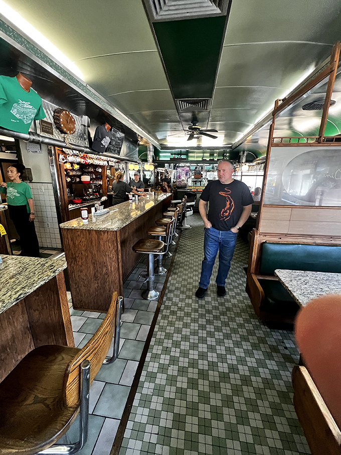 The narrow corridor between counter and booths has witnessed countless "excuse me" dances between servers and patrons. Classic diner choreography at its finest.