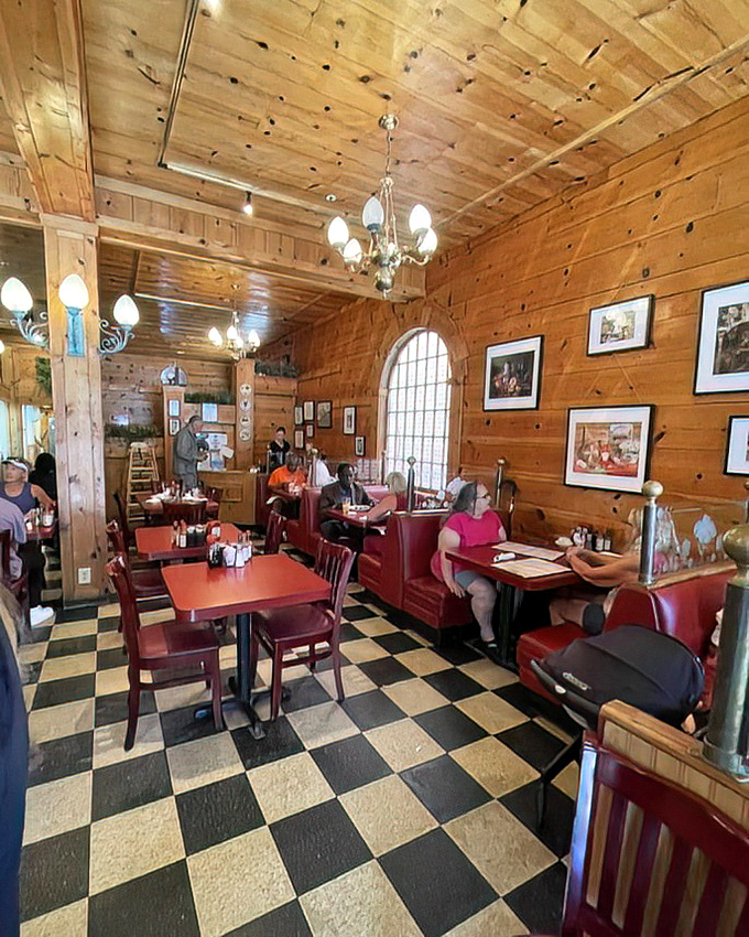 Warm pine walls, classic checkered floors, and red vinyl booths create the perfect trifecta of diner comfort. Norman Rockwell would approve.