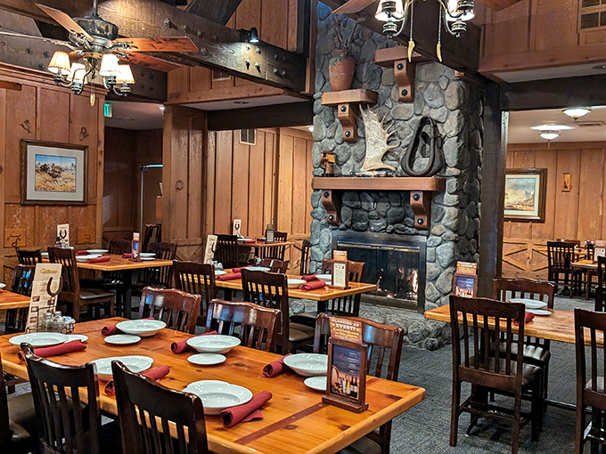 Timber, stone, and the promise of sizzling steaks. The dining room's warm wooden interior makes you feel like you've stepped into a cozy rancher's lodge.